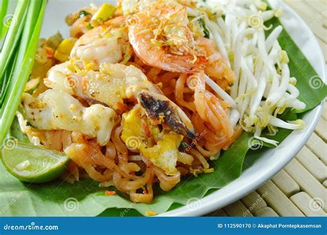 Pad Thai Stir Fried Rice Noodles With Shrimp And Squid On Plate Stock