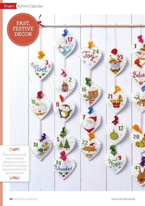 A Cross Stitch Christmas Ornament Hanging On A Wall