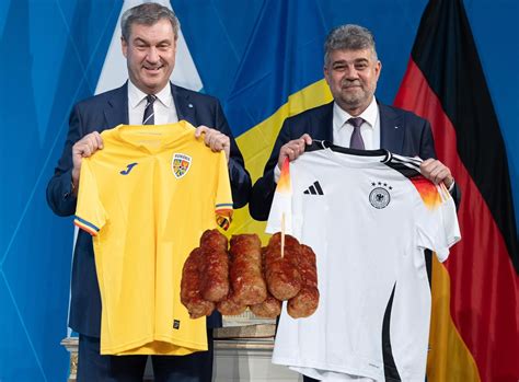 Marcel Ciolacu i a dus premierului Bavariei o ladă cu mici Vă invit