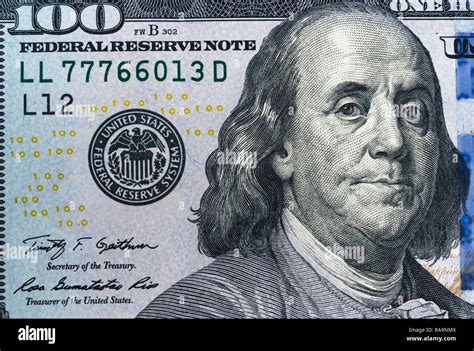 Close Up Overhead View Of Benjamin Franklin Face On 100 US Dollar Bill