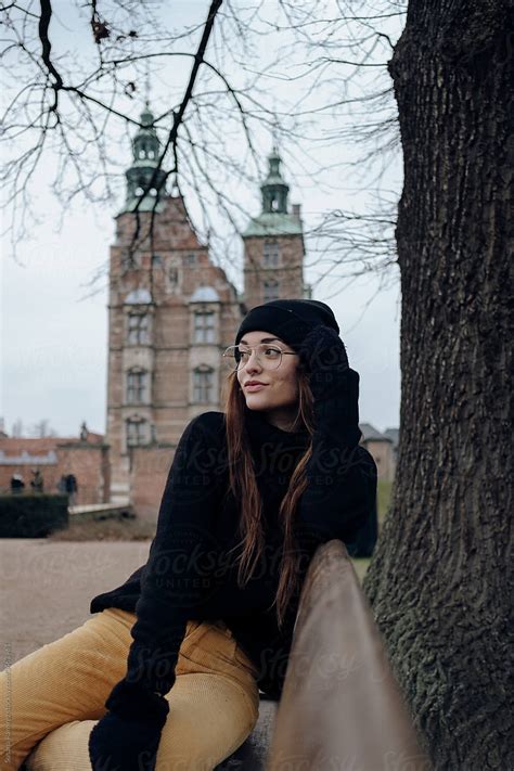 Woman Sitting On A Bench In A Copenhague By Stocksy Contributor