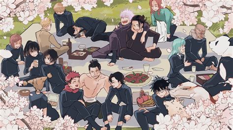 A Group Of People Sitting Around A Table With Food And Drinks