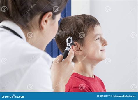 Otolaryngologist Using Otoscope Stock Image Image Of Medicine Apron