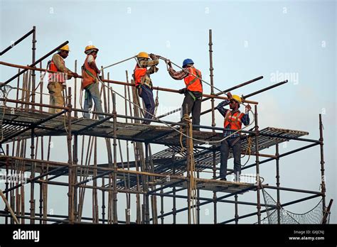 People Working On Scaffolding At Construction Site Stock Photo Alamy