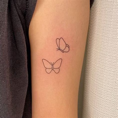 Minimalist Butterflies Tattoo On The Bicep