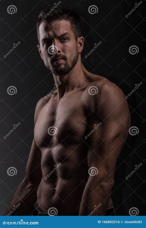 Strong Athletic Man Fitness Model Torso Showing Big Muscles Stock Photo