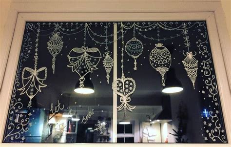The Window Is Decorated With Ornaments And Lights