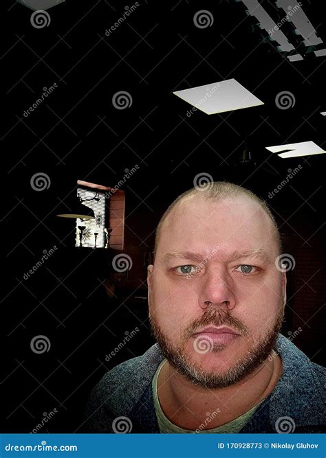43 Year Old Caucasian Man With Short Haircut And Beard Looks At Camera Stock Image Image Of