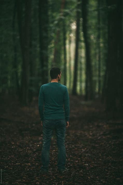 Man Standing In A Dark Forest By Stocksy Contributor Mosuno Stocksy