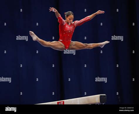 June Shilese Jones Leaps Into The Air On The Balance Beam