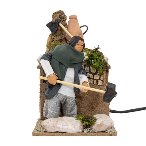 Uomo Che Spacca Pietre Per Il Presepe In Movimento