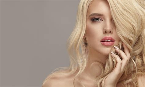 Premium Photo Pretty Young Blonde Woman With Nude Makeup Has A Curly Long Bright Hair Close Up
