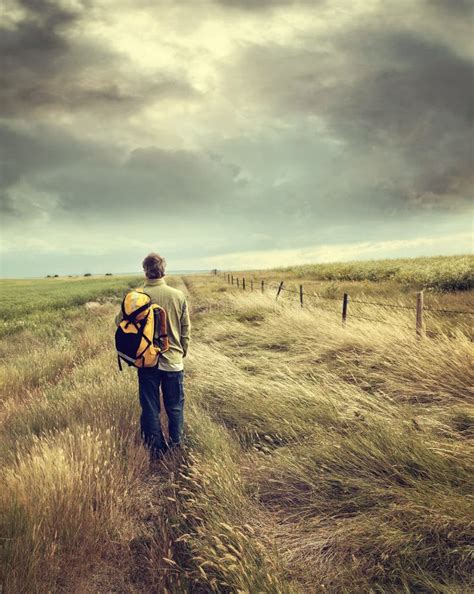 Man Walking Down Country Road Stock Photo Image Of Baggage Prairie