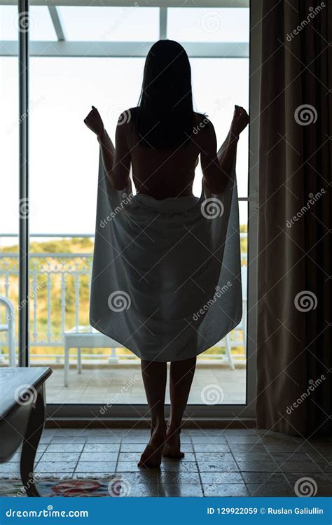 Silhouette Of A Half Naked Woman With A Towel In Front Of The Panoramic