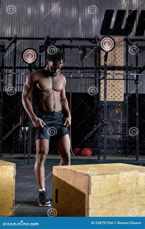 Fit Shirtless Athletic African Man Standing By Plyometric Wood Box At