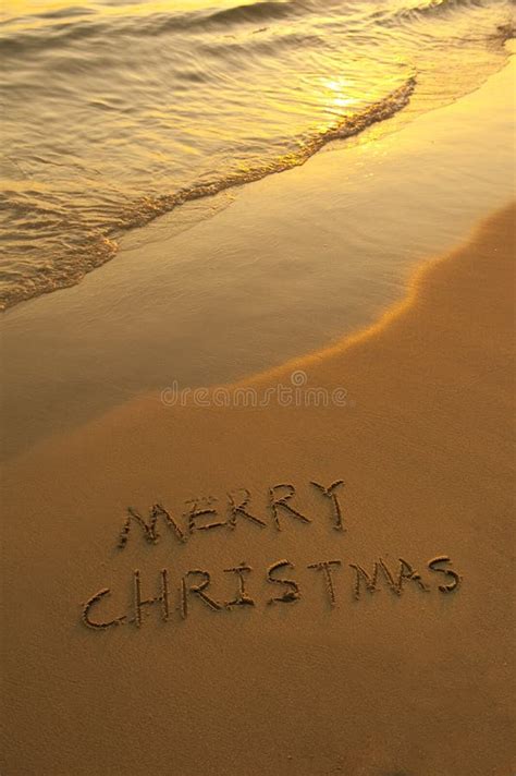 Merry Christmas Written On Tropical Beach White Sand With Snowman Stock