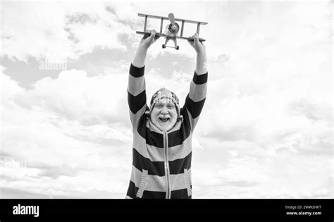 Surprised Senior Retired Man Mature Man At Retirement Old Man On Sky Background With Toy Plane