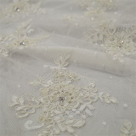 Tissu tulle brodé perlé ivoire Tissus en Ligne