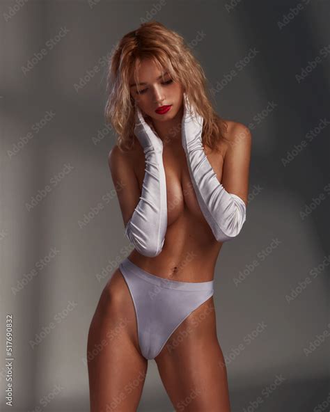 A Beautiful Half Naked Woman Covering Chest With Long White Gloved
