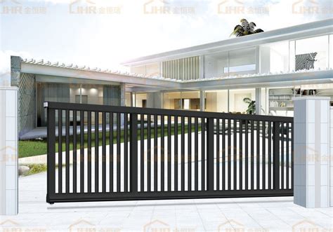 An Image Of A Modern House With A Gate And Landscaping Area In The