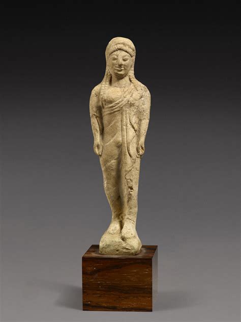 A Greek Terracotta Figure Of A Kouros Circa 1st Half Of The 5th