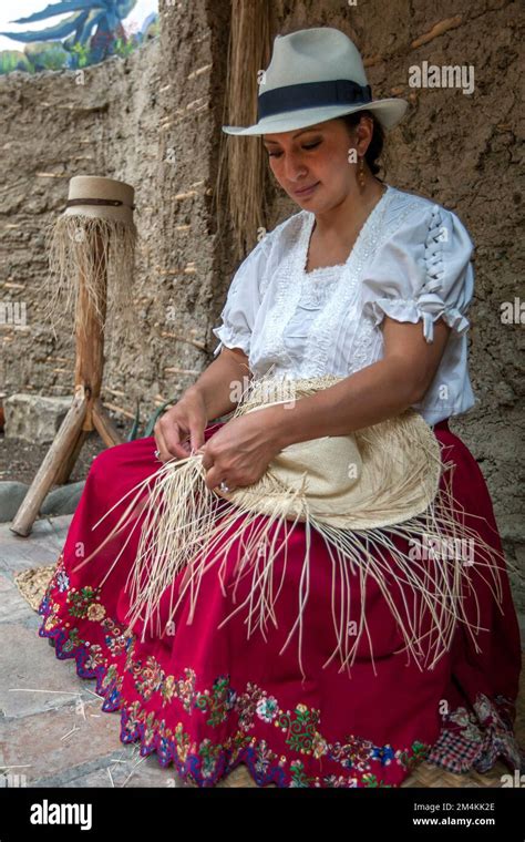 A Lady Demonstrates How To Weave A Toquilla Straw Hat Also Known As A