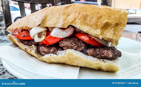 Turkish Kofte Ekmek Meatball Sandwich With Tomatoes Onion And Green