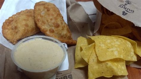 Two Empanadas Chips Queso The Naked Empanada