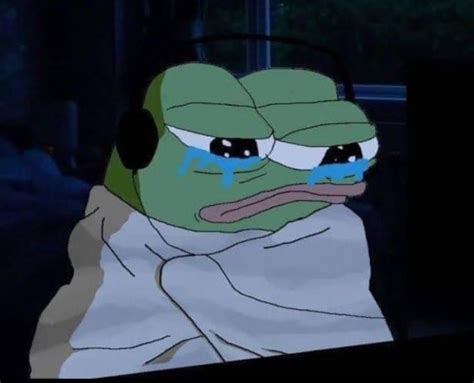A Cartoon Frog With Headphones On And Wearing A White Robe Sitting In
