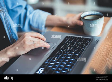 Close Up Hand Of Girl Holding Coffee Mug Business Women Typing And