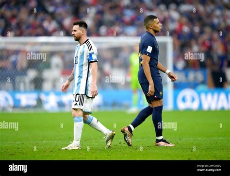 Argentina S Lionel Messi Left And France S Kylian Mbappe Walk Past