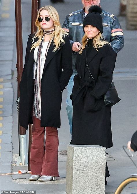 Reese Witherspoon Looks Chic In A Black Coat And Beanie Hat As She