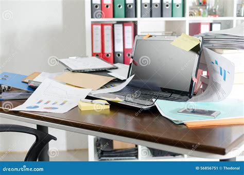 Untidy And Cluttered Desk Stock Image Image Of Objects 56856751