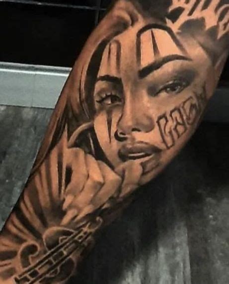 A Woman S Arm With Tattoos On It