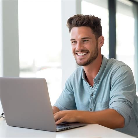 Premium Ai Image A Man Smiles While Using A Laptop With A Smile On His Face