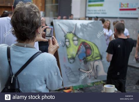 Woman Takes A Photo Of A Street Artist Street Art Night Market Temple