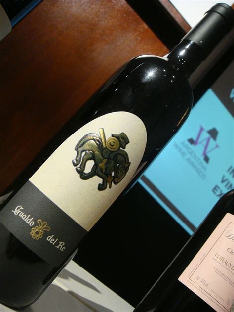 A Bottle Of Wine Sitting On Top Of A Table