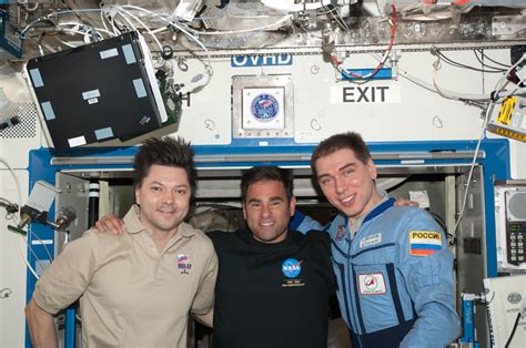 S124E007010 STS 124 Expedition 17 Crew Pose For On Orbit Portrait