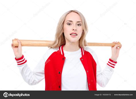 Woman Holding Baseball Bat Behind Shoulders Stock Photo