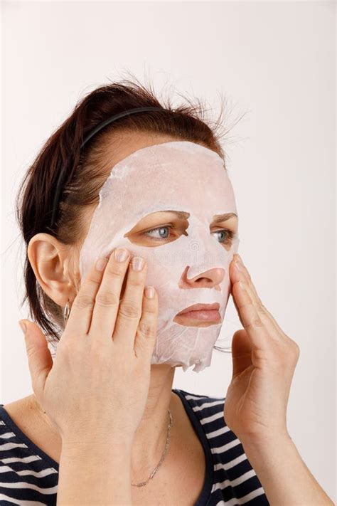 Housewife Woman With A Sheet Mask On Her Face Stock Image Image Of Face Background 101003723