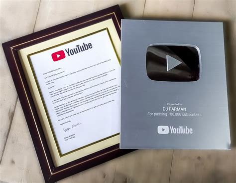 An Open Book With A Video Play Button On The Front And Inside Sitting