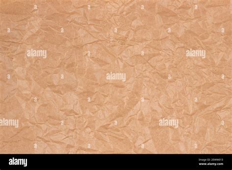 Old Crumpled Brown Craft Paper Texture Background Top View Stock Photo