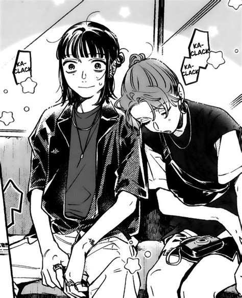 Two People Sitting Next To Each Other On A Couch