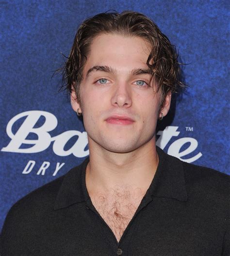 A Close Up Of A Person Wearing A Black Shirt