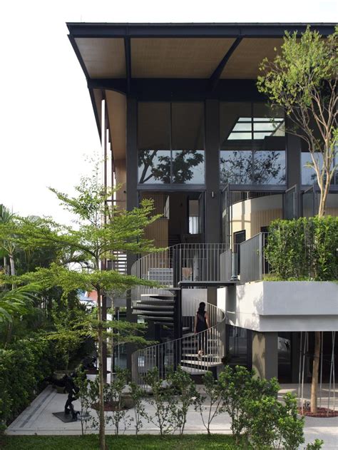 An Apartment Building With Balconies On The Second Floor And Stairs