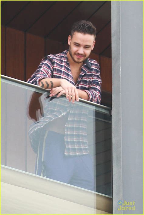 Shirtless Liam Payne Blows Kisses To Fans From Hotel Balcony Photo