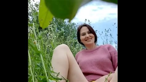 Naked Horny MILF In A Chamomile Field Masturbates Pisses And Wards Off