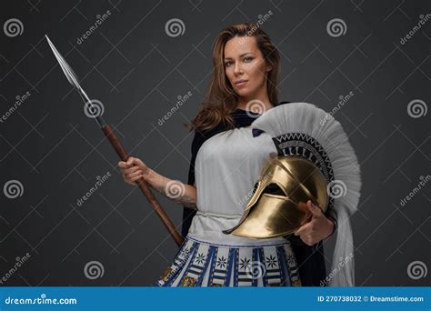 Female Greek Warrior With Spear And Golden Plumed Helmet Stock Photo