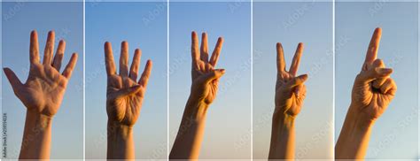 Hand Countdown Concept Hand Counting Down On Blue Background