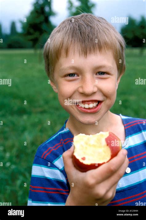 Boy Eating Apple Stock Photo Alamy